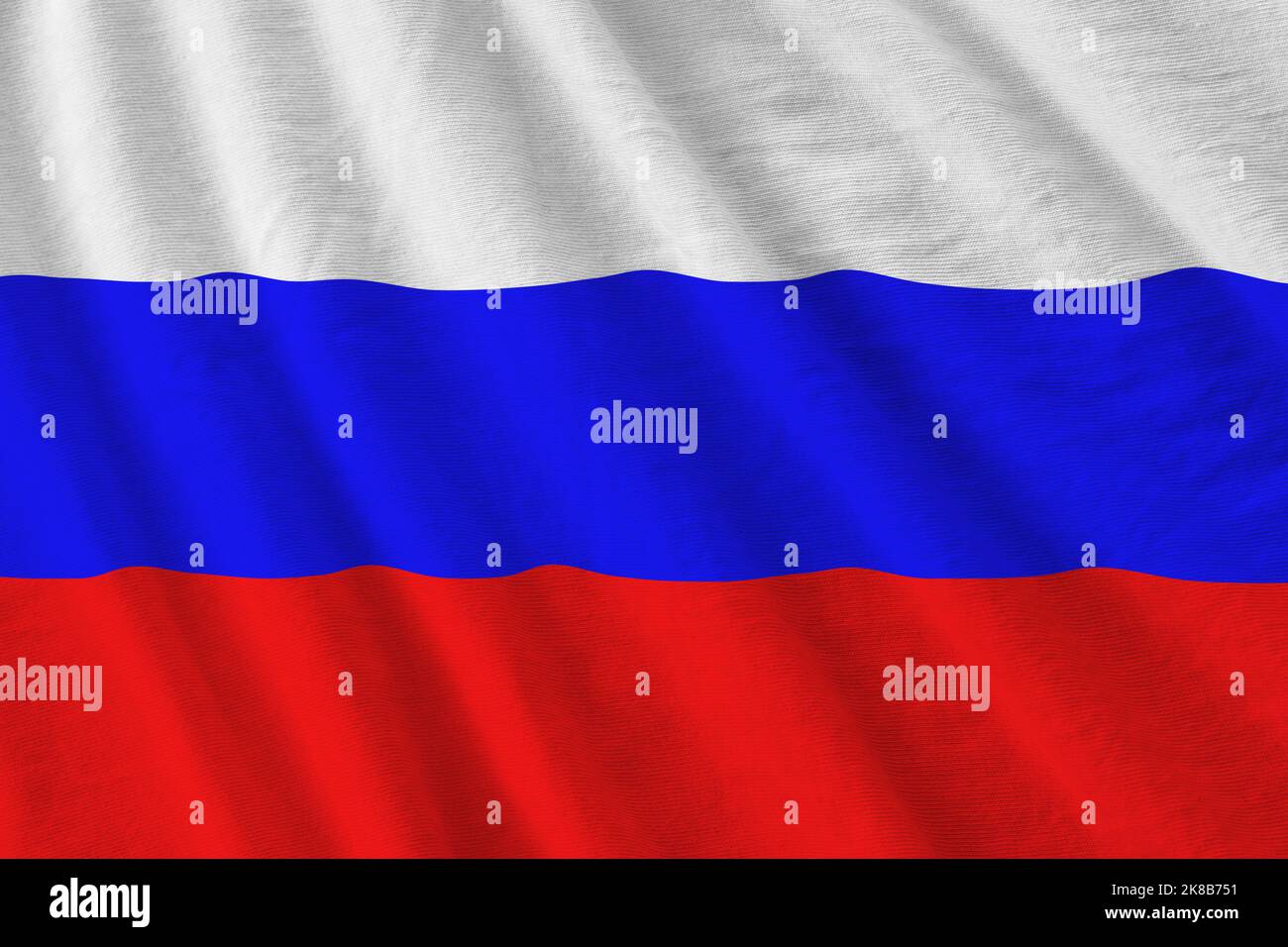 Russia flag with big folds waving close up under the studio light ...