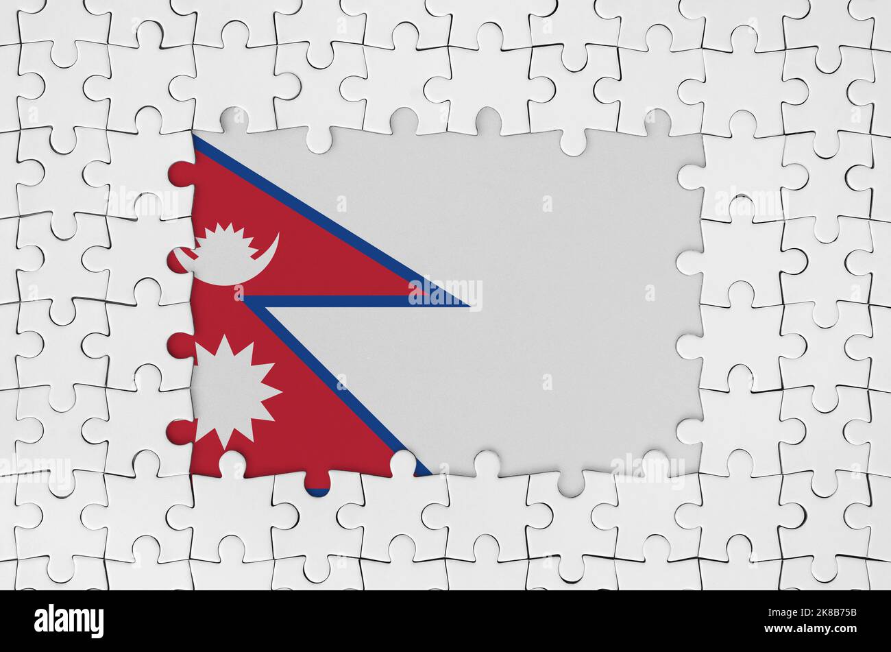 Nepal flag in frame of white puzzle pieces with missing central parts ...