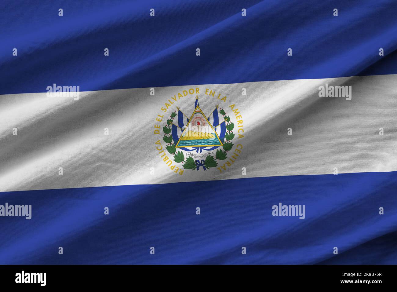 El Salvador flag with big folds waving close up under the studio light ...