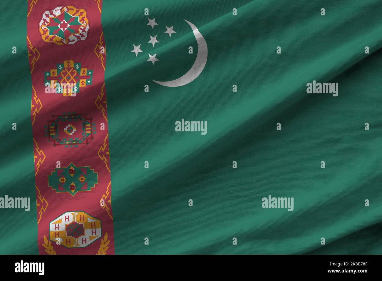 Turkmenistan flag with big folds waving close up under the studio light ...
