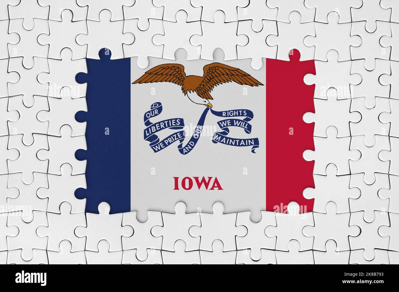 Iowa US state flag in frame of white puzzle pieces with missing central ...