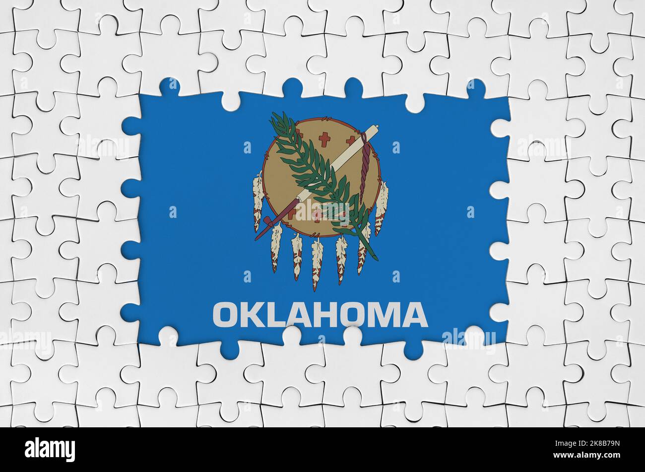 Oklahoma US state flag in frame of white puzzle pieces with missing ...