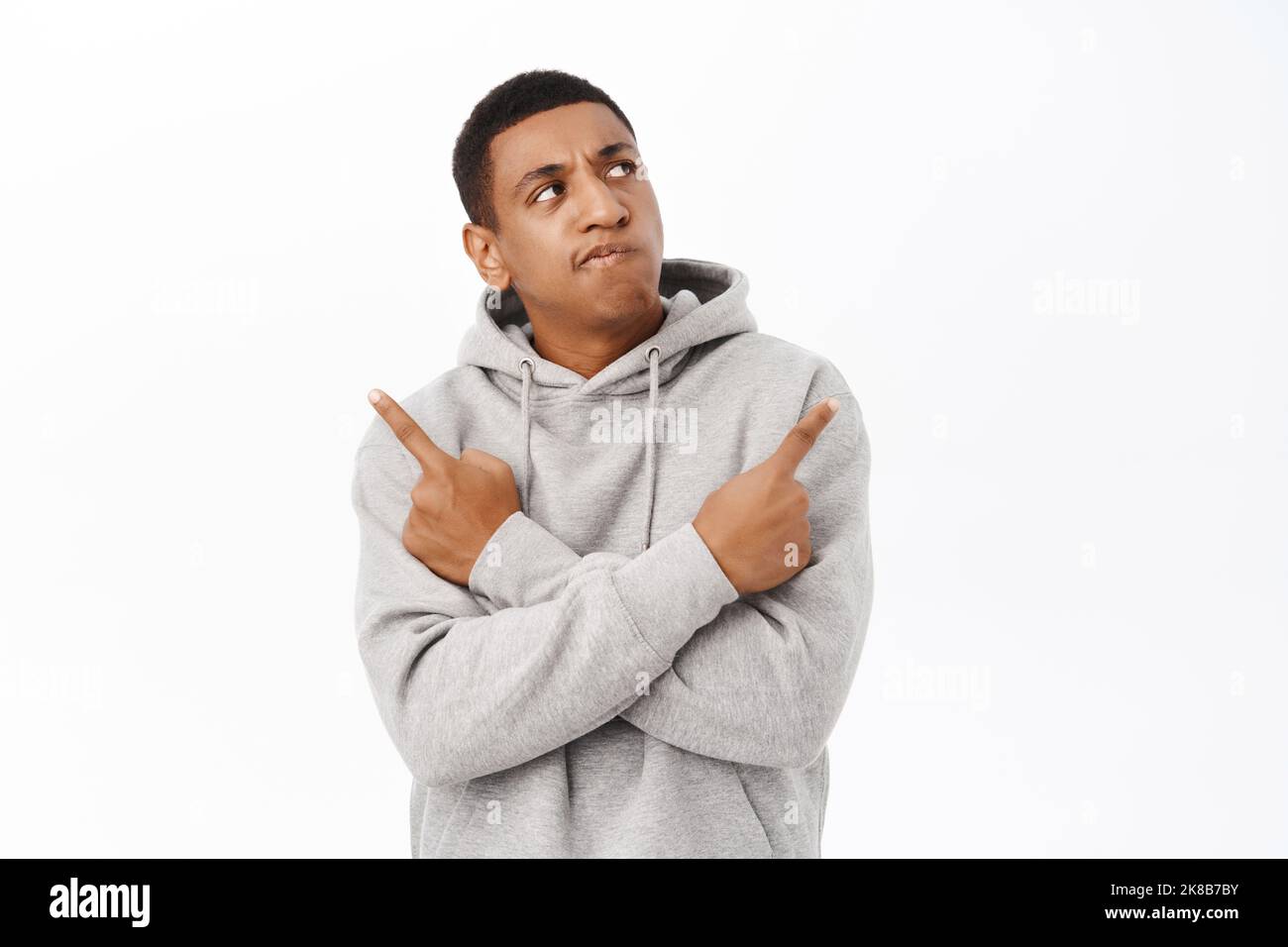 Portrait of african american guy making decision with confused face ...