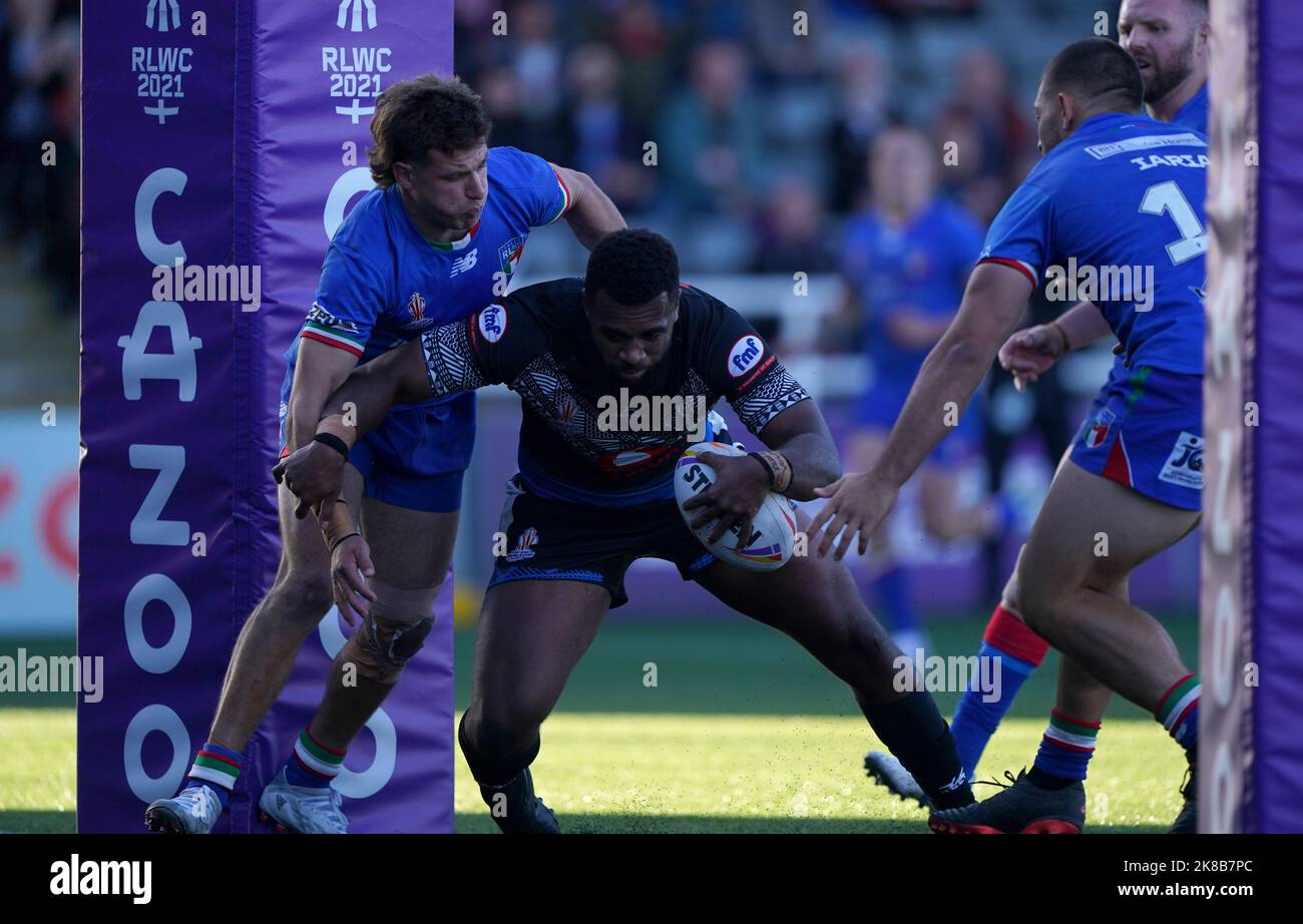 Fiji's Ben Nakubuwai (right) evades a tackle from Italy's Luke Polselli ...