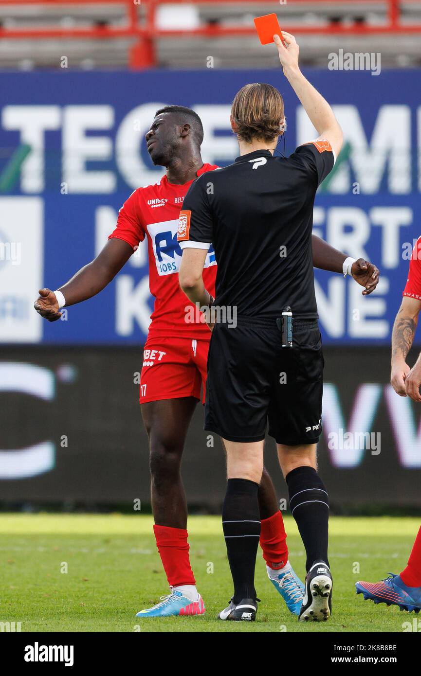 Kortrijk's Pape Habib Gueye receives a red card from the referee during ...