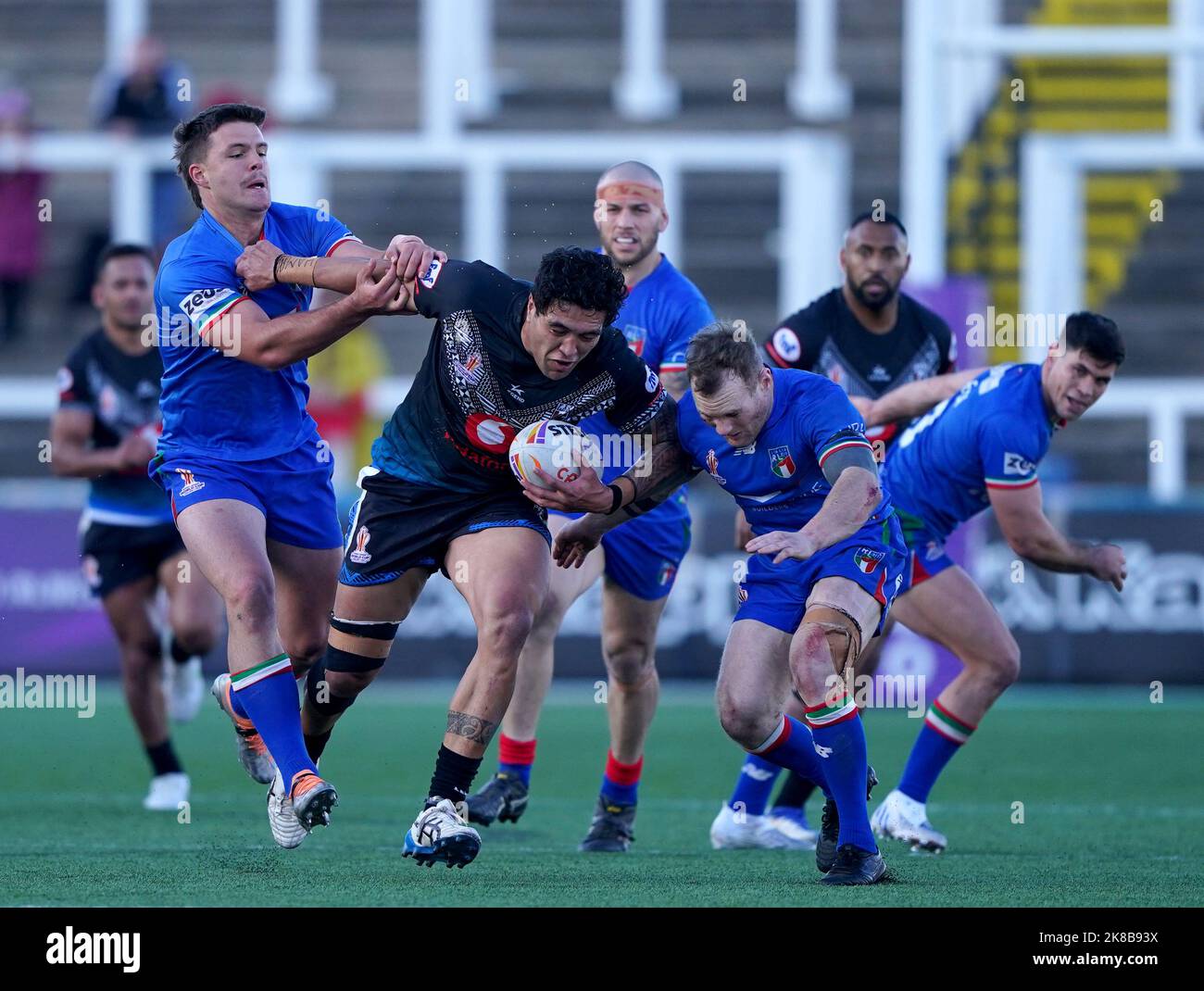 Italy's Luke Hodge (left) and Richard Lepori (right) tackle Fiji's ...