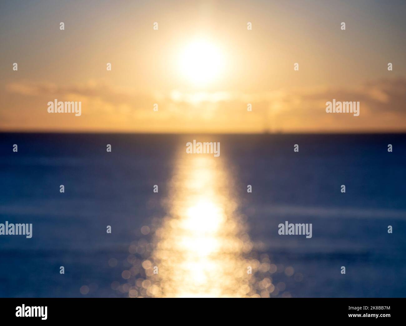 Blurred background. Sun shining in sky with clouds during sunset dawn ...