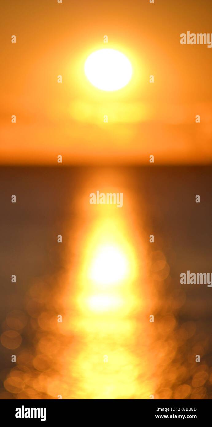 Blurred background. The sun shining in the sky during sunset dawn ...