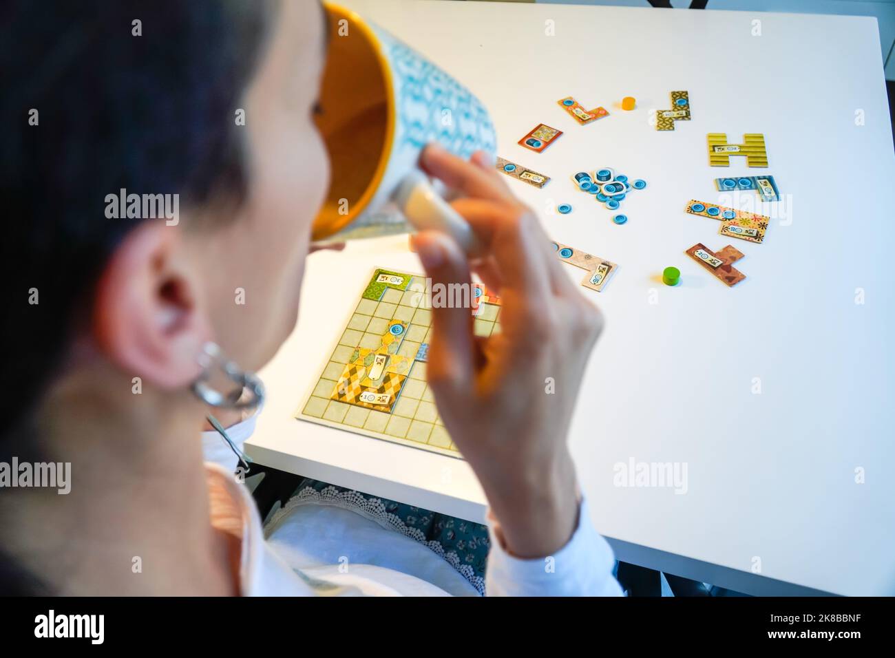 Woman playing board game hi-res stock photography and images - Alamy