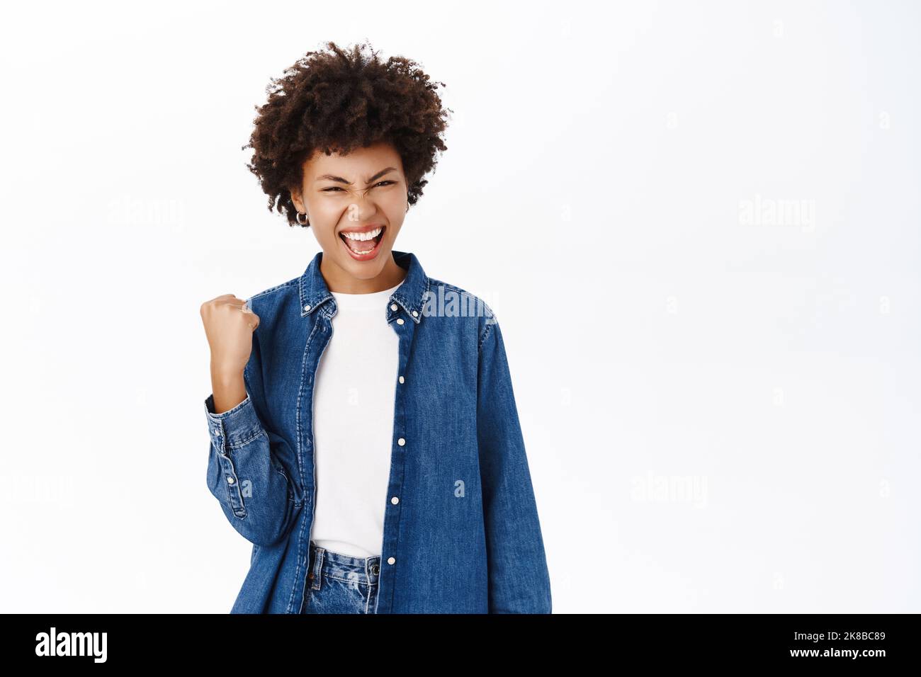 Enthusiastic african american woman winning and rejoicing, celebrating ...