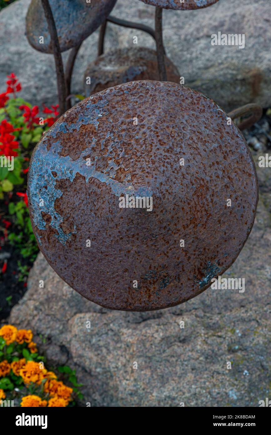 A garden sculpture of a toadstool, sculpture metal mushrooms rusted old ...