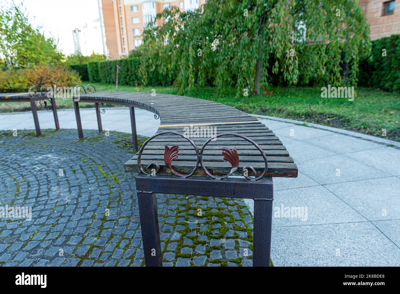 wooden romantic bench in a quiet Park in summer with trees Stock Photo ...