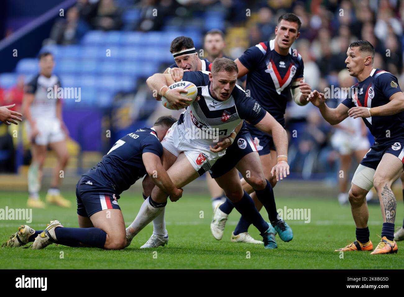 England's Tom Burgess (centre) is tackled during the Rugby League World ...