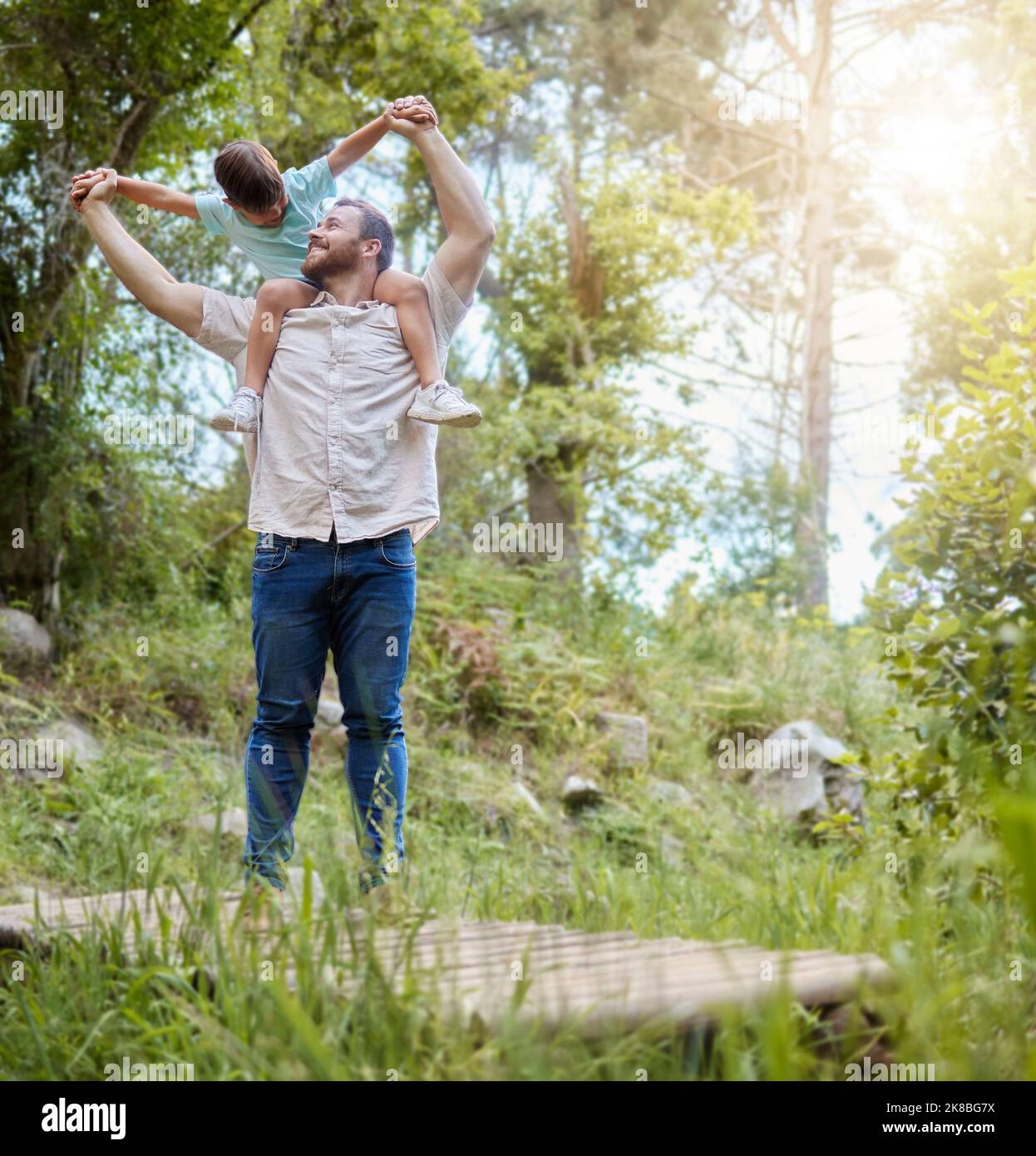 Days in nature. a young father and son spending time together outside ...