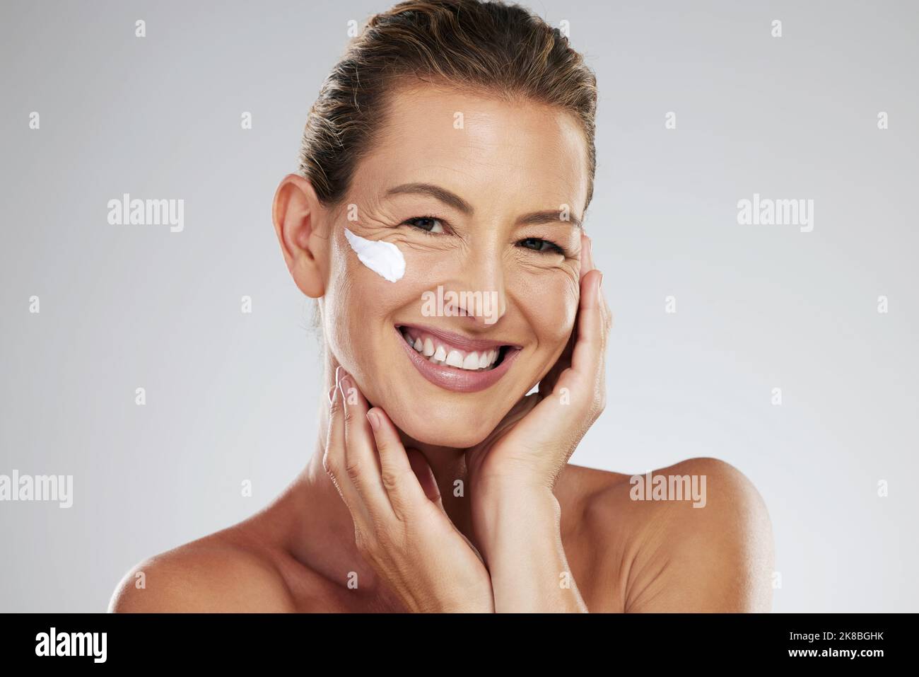 Cream, face wellness and mature woman with skincare product for health ...