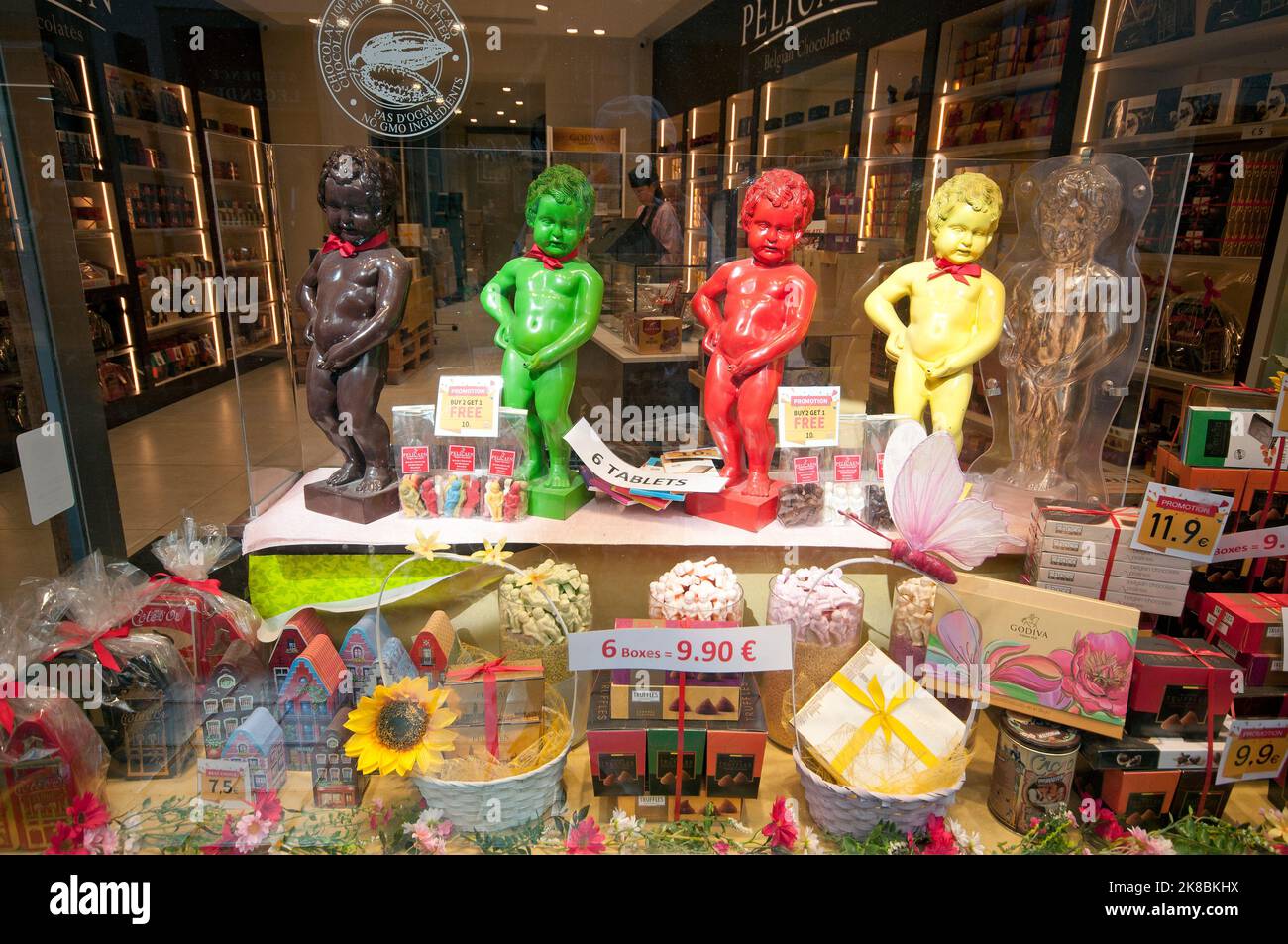 Coloured statues of Manneken Pis in a chocolaterie shop, Brussels ...