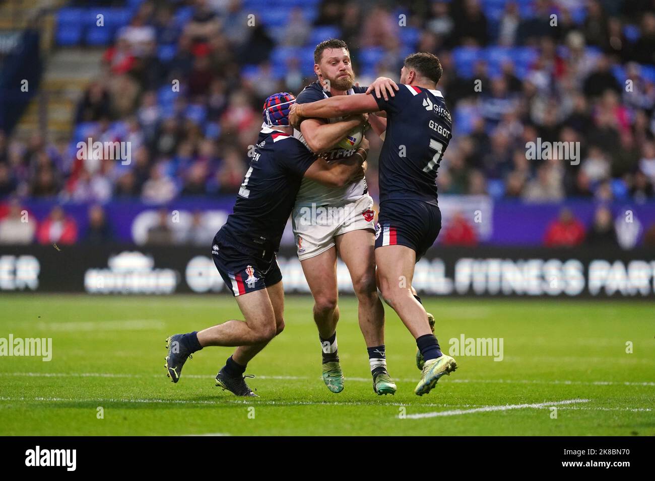 England's Elliot Whitehead (centre) is tackled by France's Benjamin ...