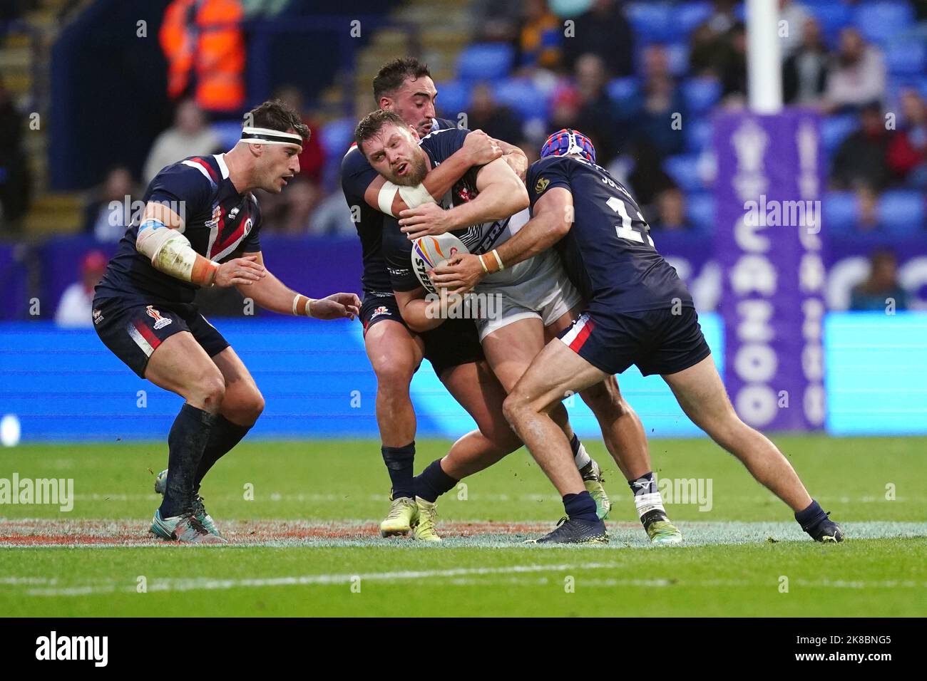 England's Elliot Whitehead (centre) tackled by (left to right) France's ...
