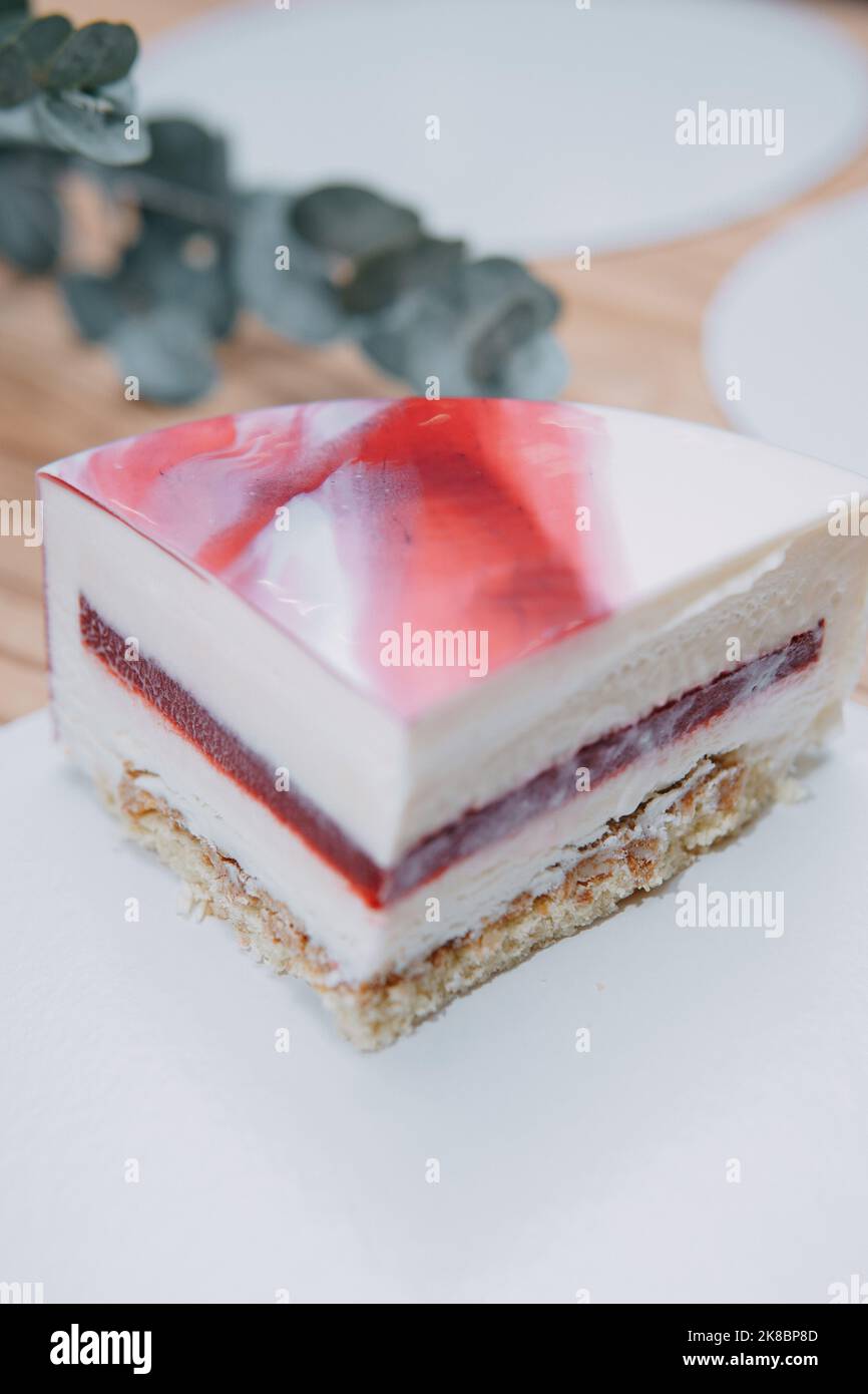 A slice of mousse cake in the cut. Making a cake at a culinary master ...