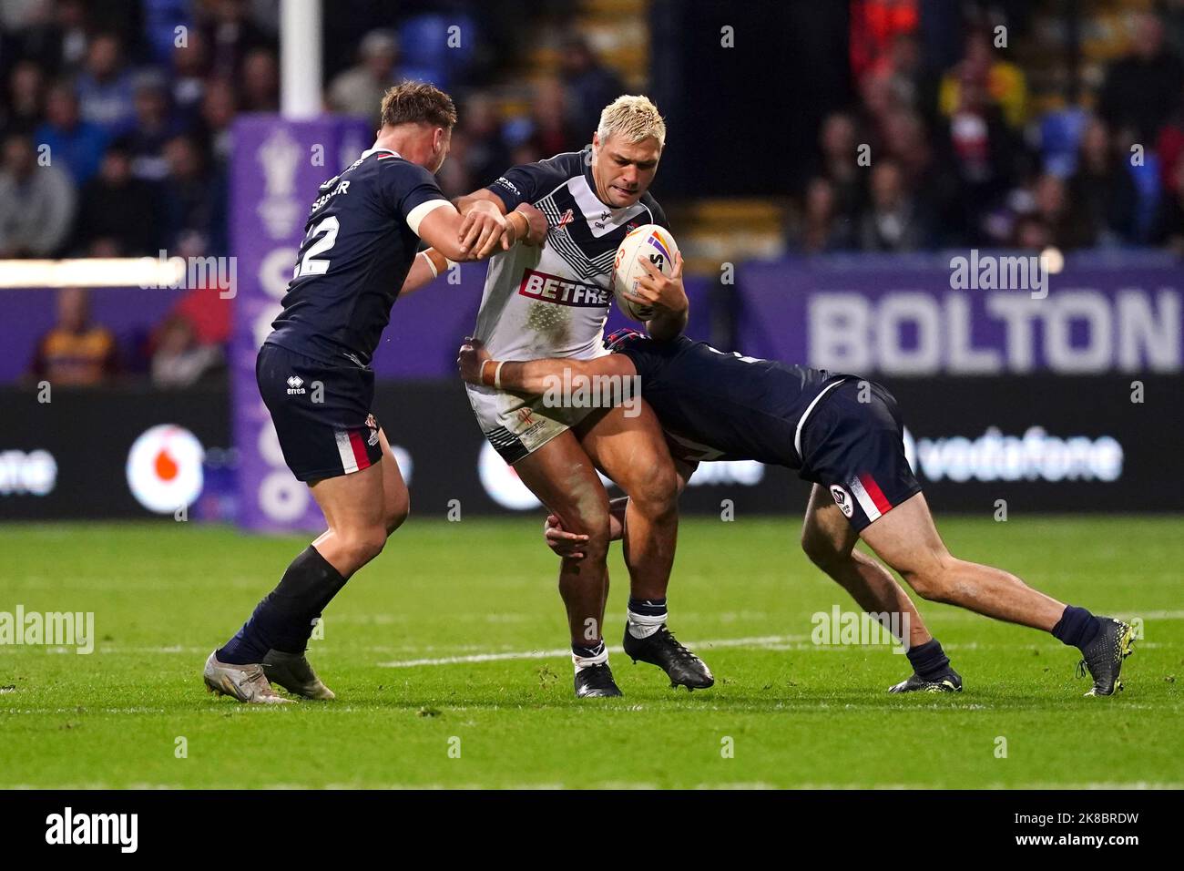 England's Ryan Hall is tackled by France's Paul Seguier (left) and ...