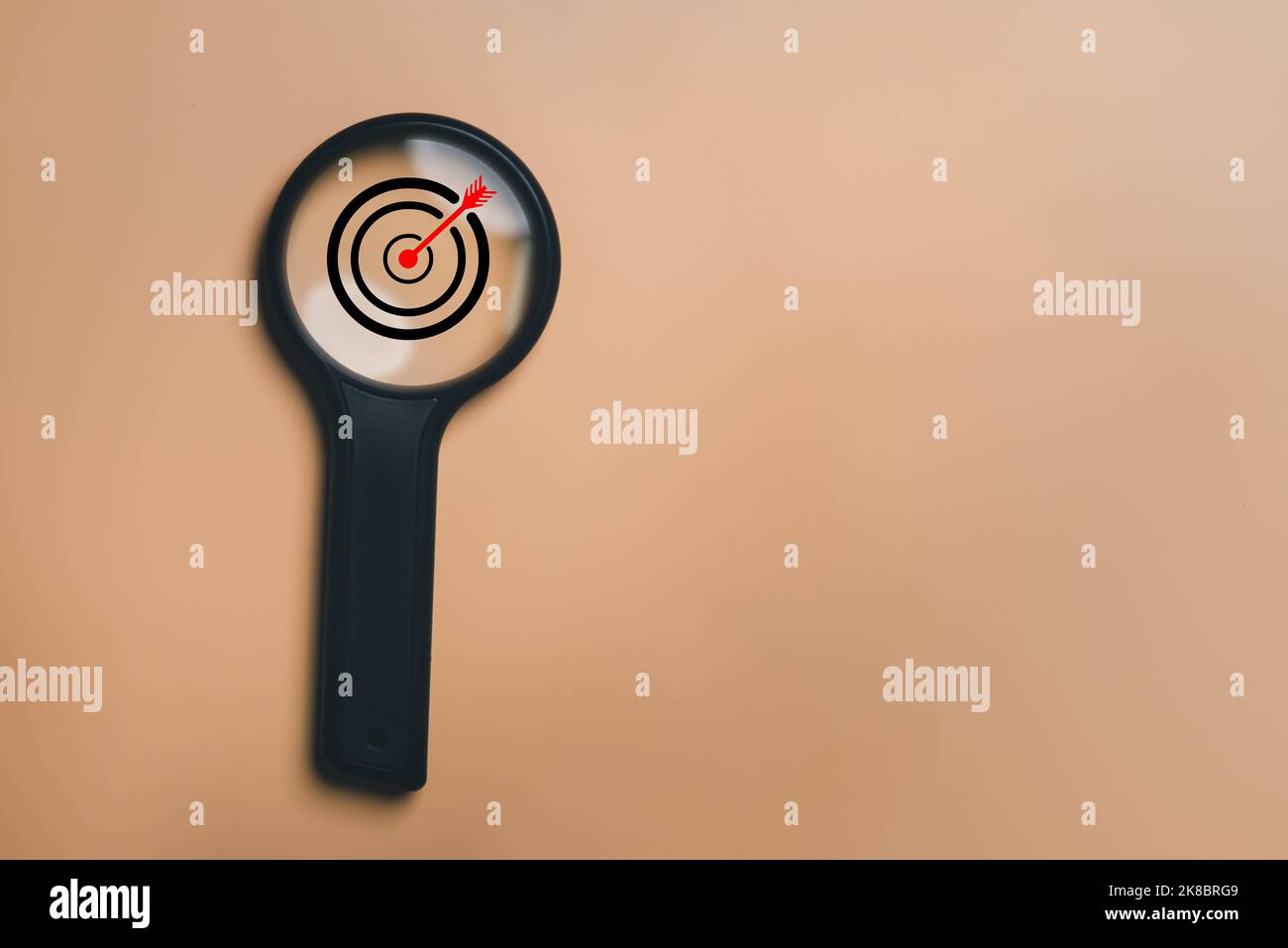 Board with magnifier glass for focus business objective, isolated ...