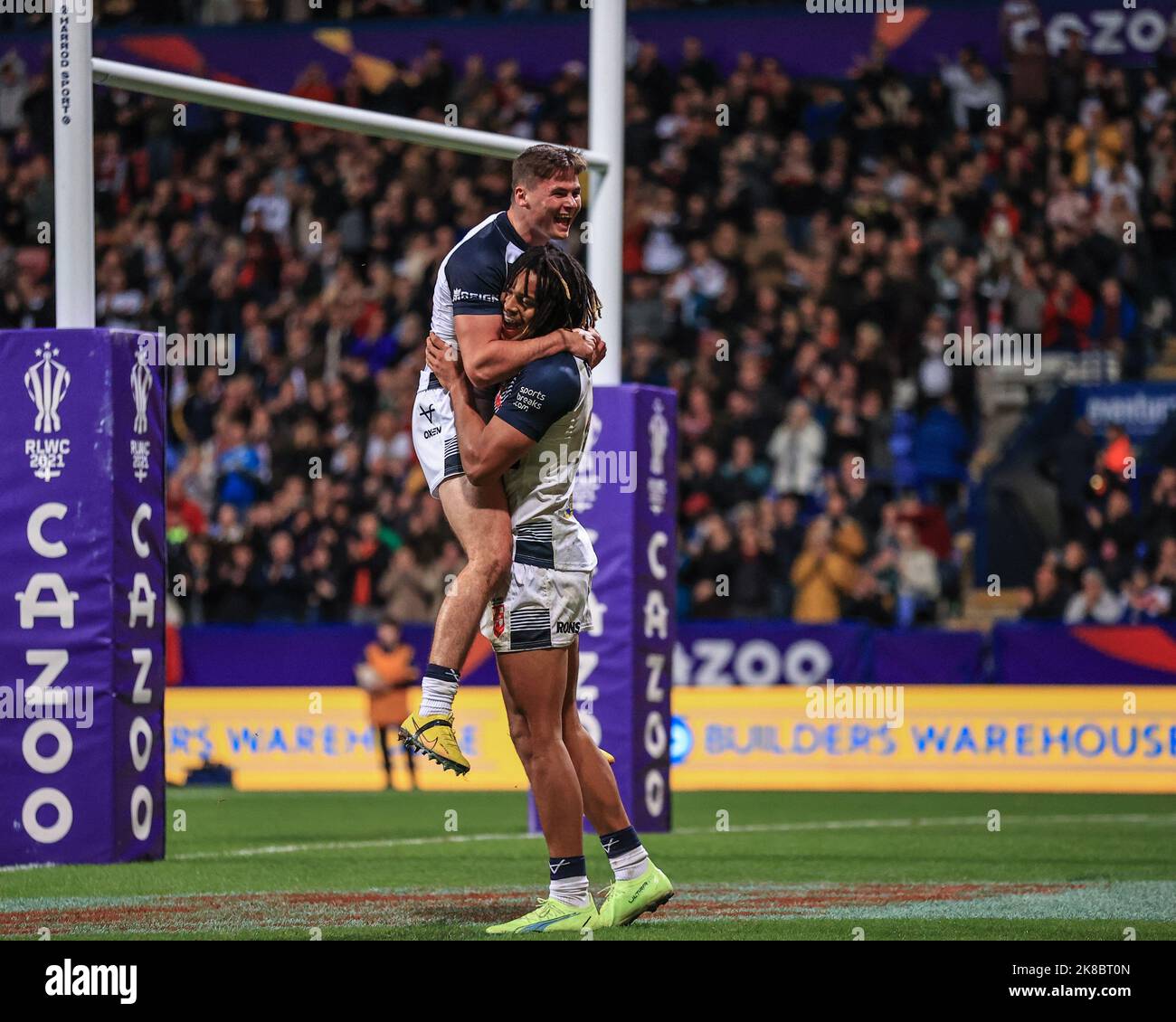 Dom Young of England celebrates his try with Jack Welsby of England ...