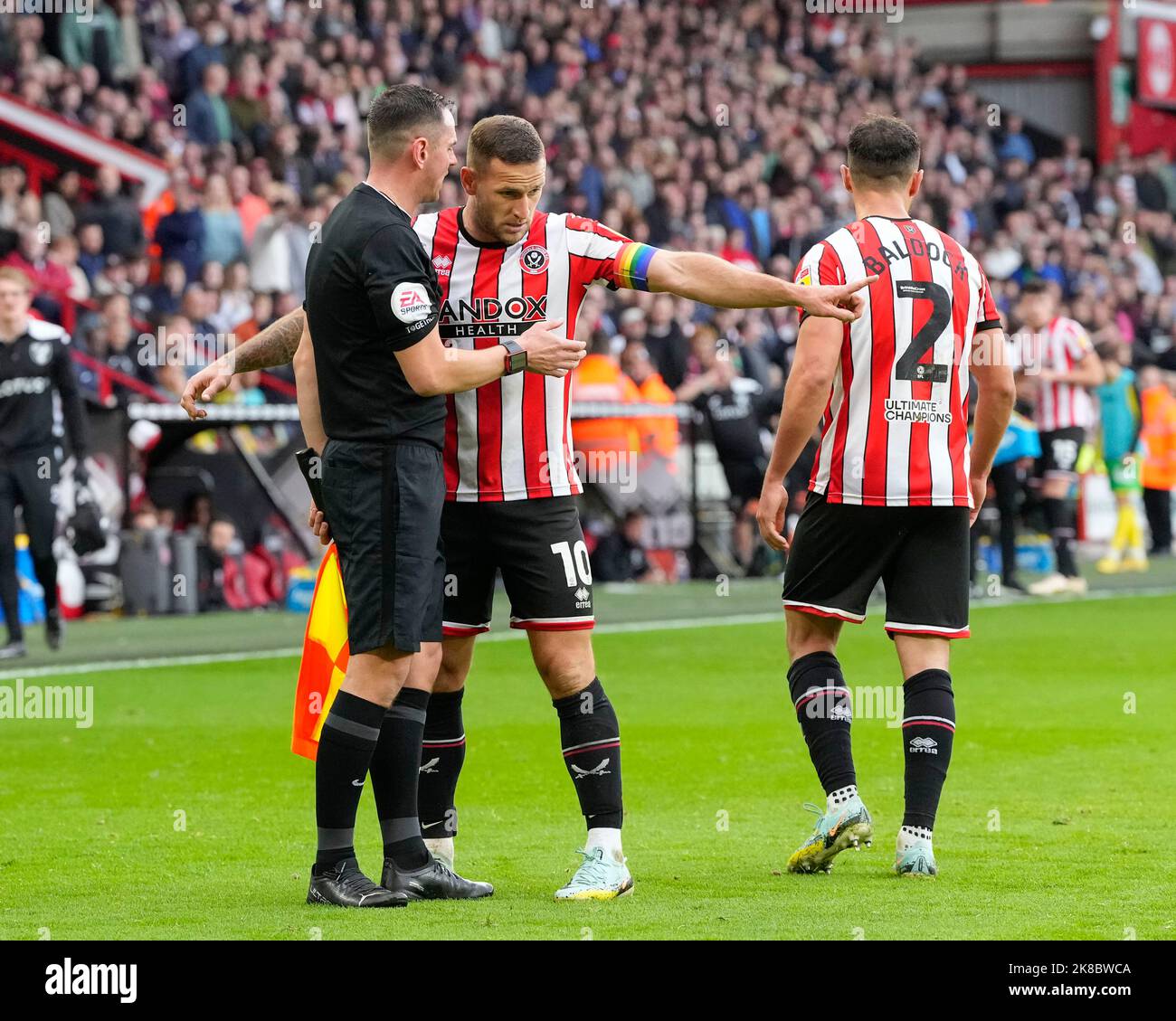 Billy Sharp #10 of Sheffield United listens to an assistant referee ...