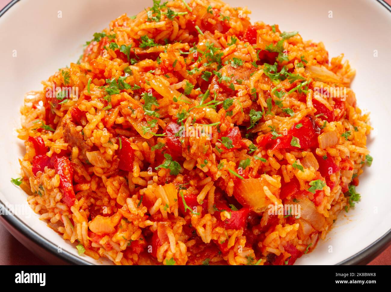 tomato chorizo rice in white bowl Stock Photo - Alamy