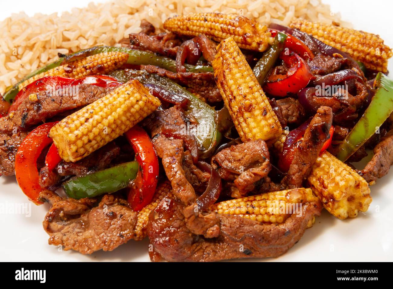 Beef and Sichuan pepper stir fry with rice close up Stock Photo - Alamy