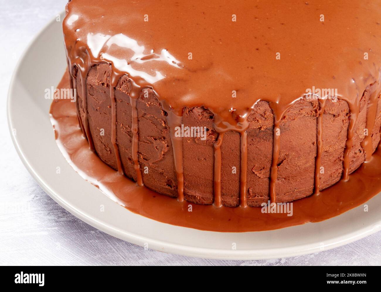 chocolate drizzle cake section Stock Photo - Alamy
