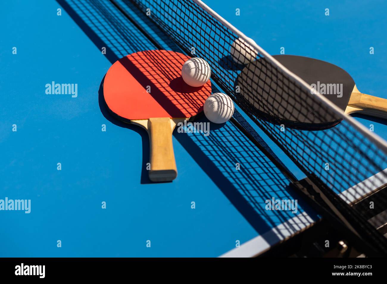 Ping pong table, rackets and balls in a sport hall Stock Photo - Alamy