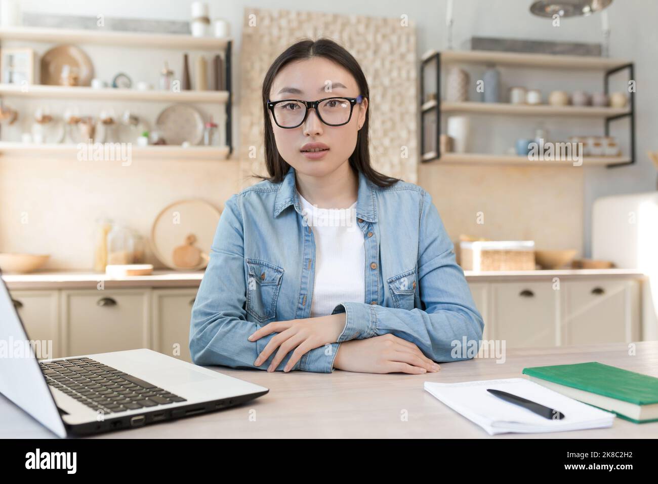 Online consultation of a psychologist. A young Asian female specialist ...