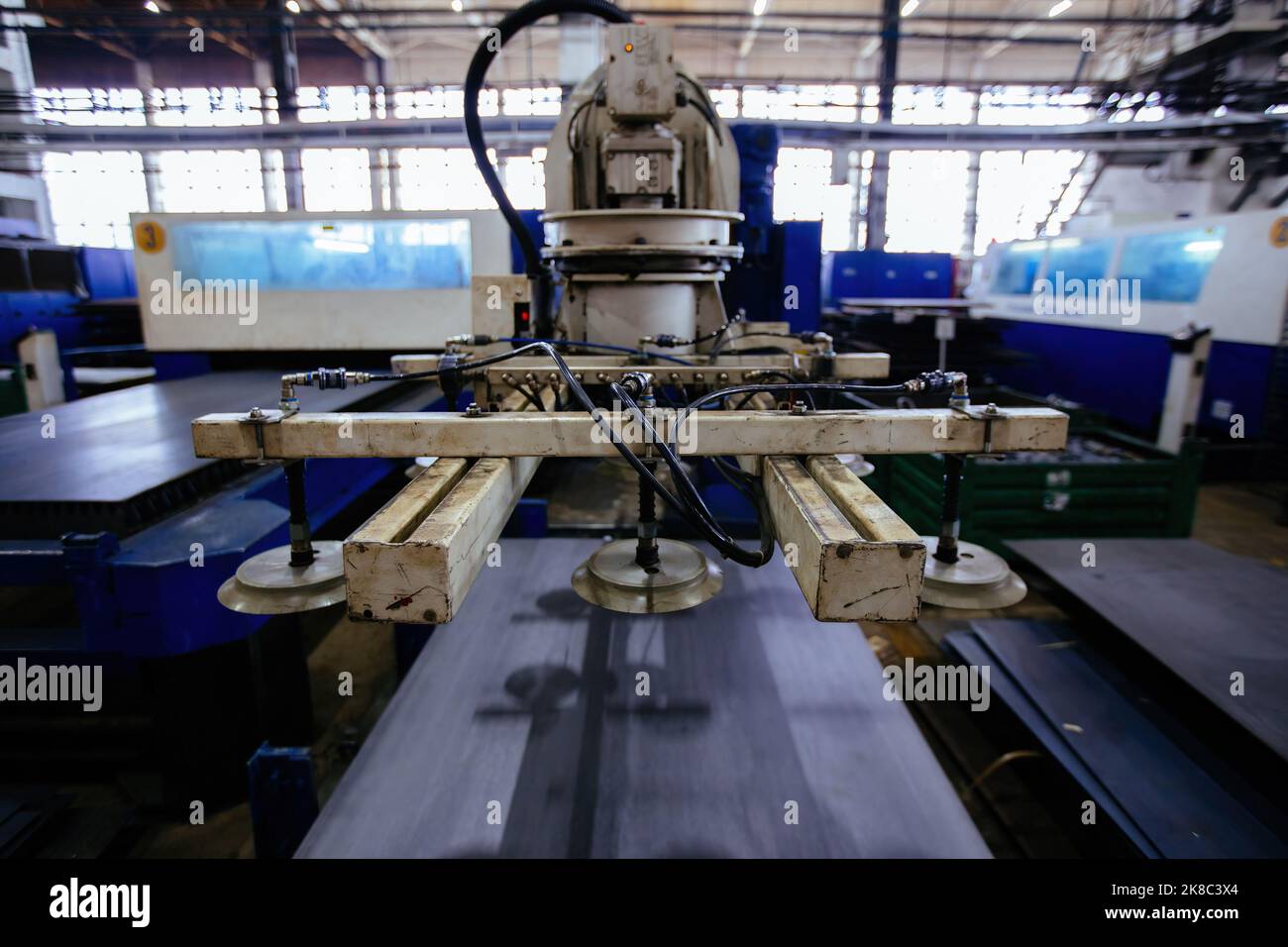 Mechanical vacuum lifter. Loading unit of cutting machine Stock Photo ...