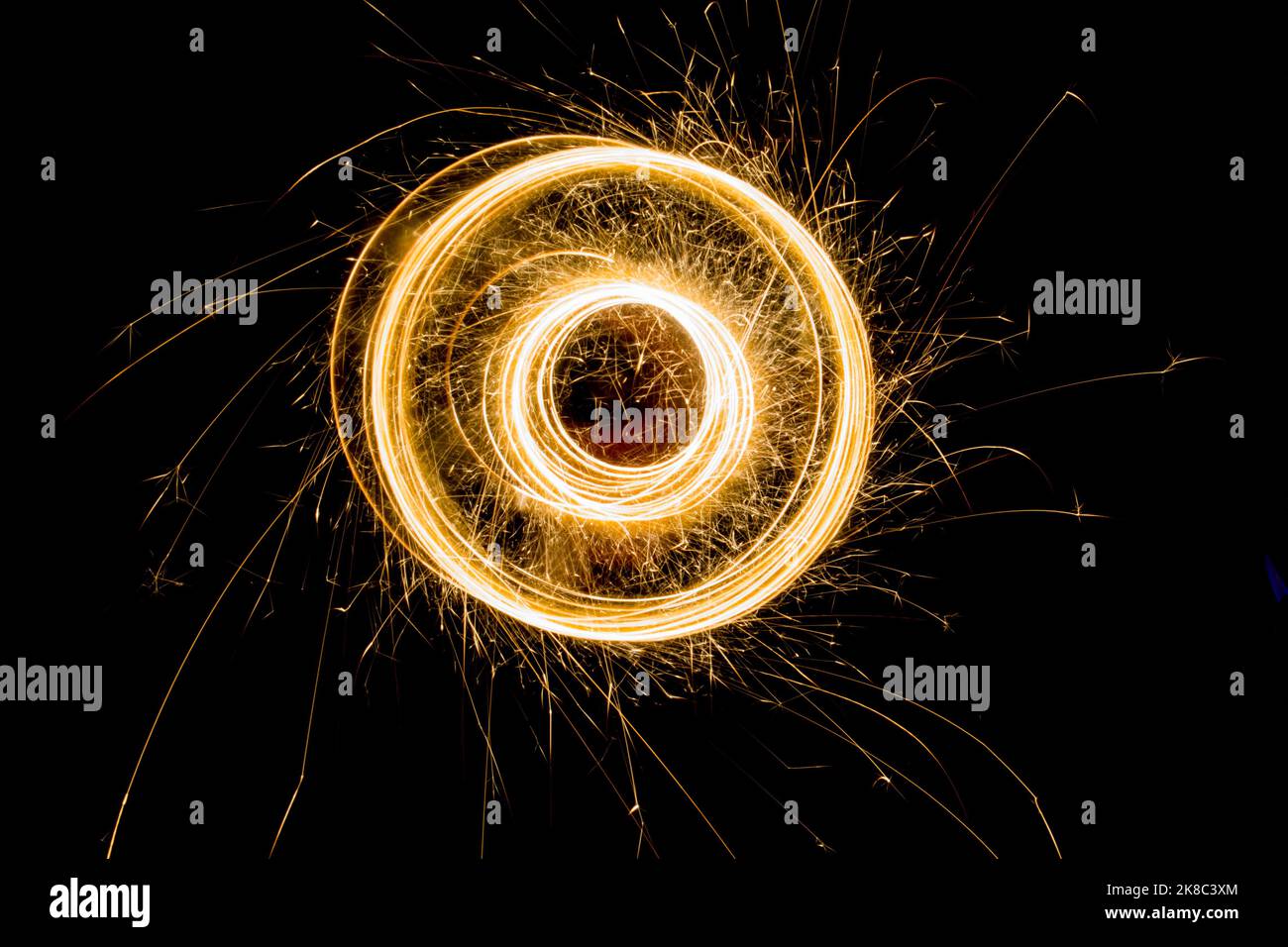 Sparks from the circular rotation of lights on a black background Stock ...