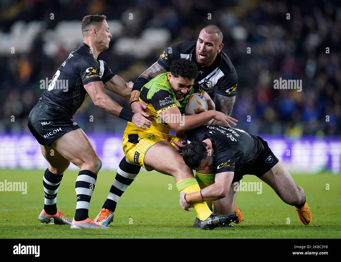 Jamaica's Jacob Ogden is tackled by New Zealand's Scott Sorensen (left ...
