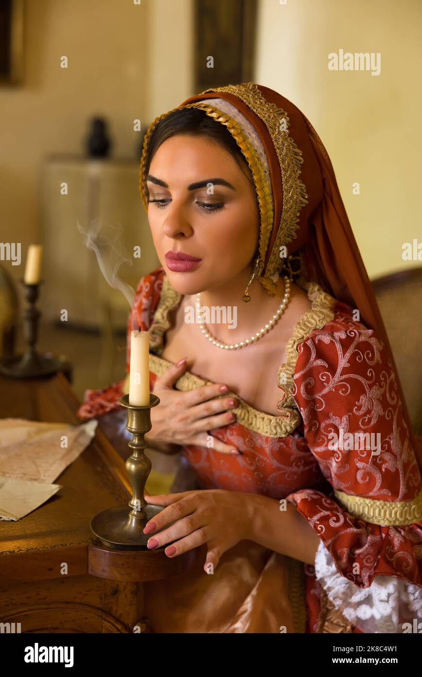 Closeup portrait of a lady in authentic renaissance dress and matching ...