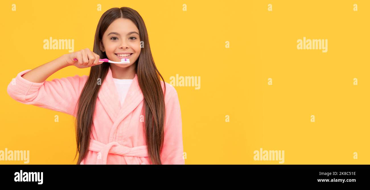 child in cozy sleepwear brush teeth. dental health and beauty. oral ...