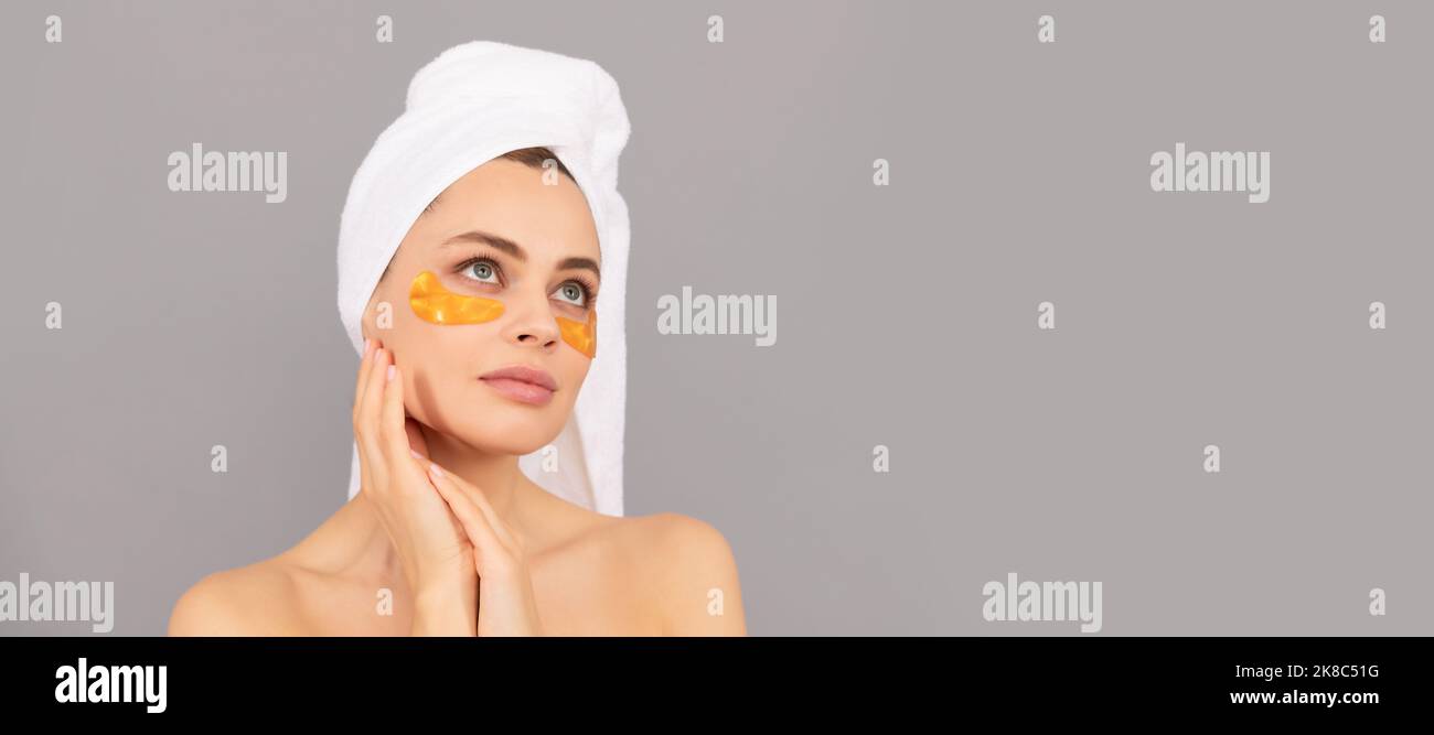 Eye patches, patch under eyes. beautiful girl with terry towel use ...
