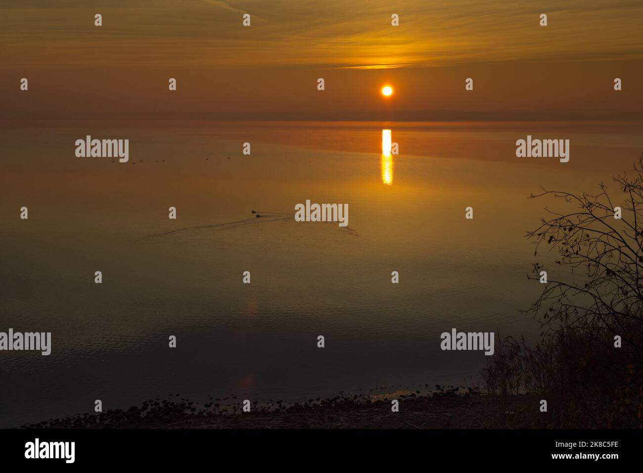 reflection of the sun during sunrise Stock Photo - Alamy