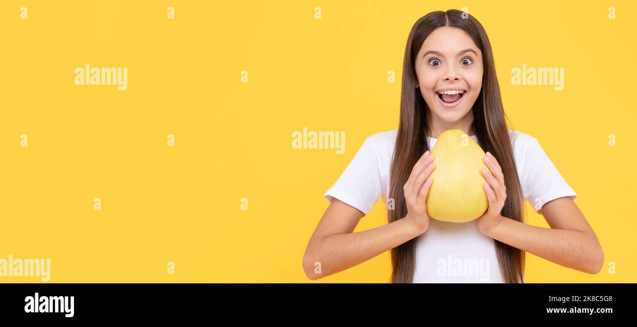 happy kid girl hold big citrus fruit of yellow pummelo or pomelo full ...