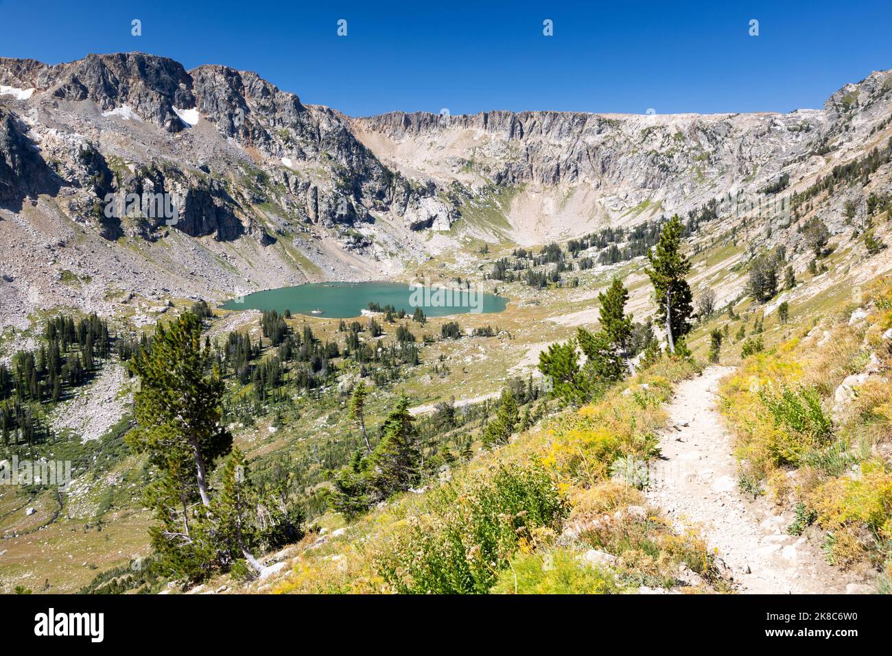 The Lake Solitude Trail winding above Lake Solitude in the North Fork ...