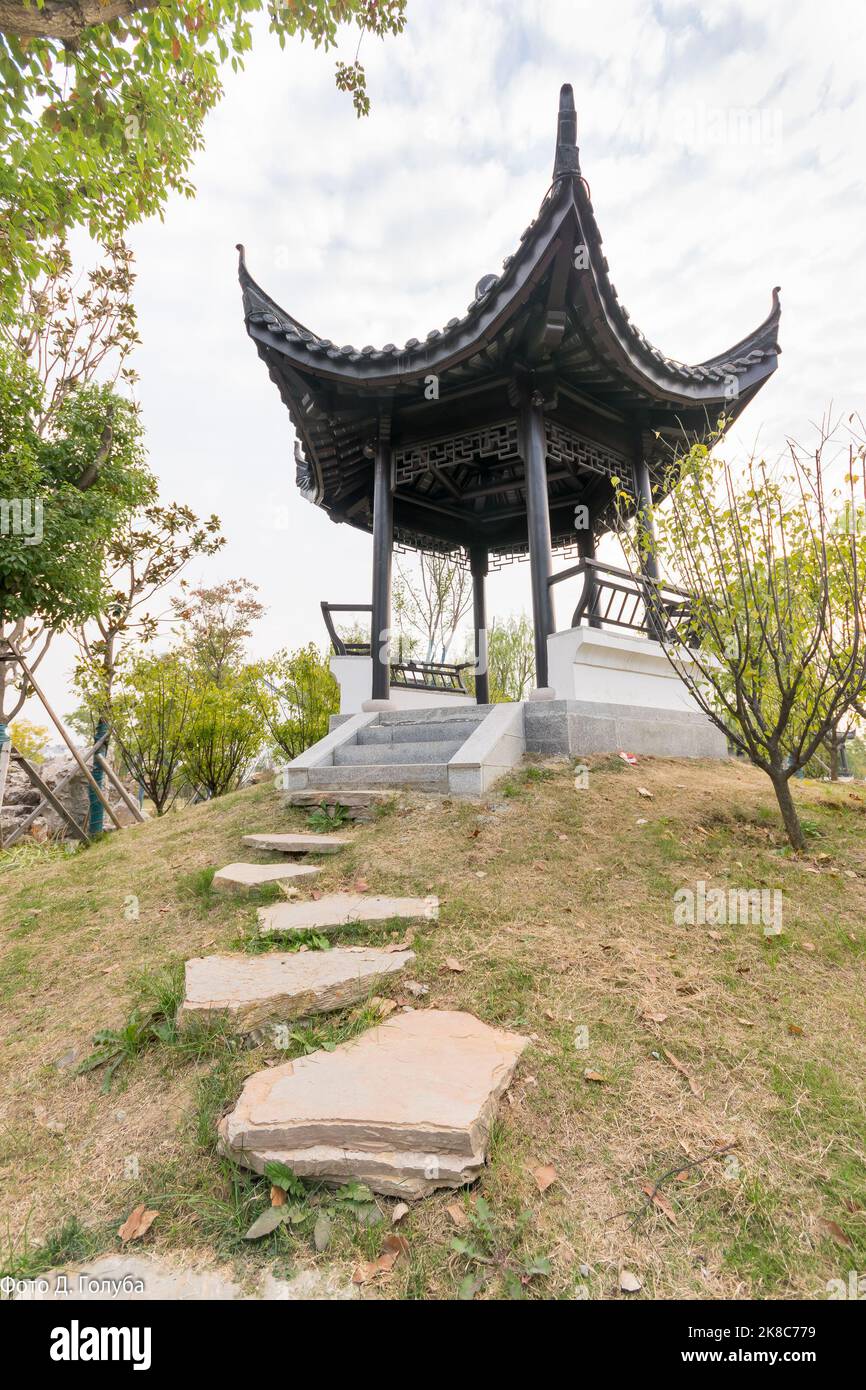 old gazebo in china on a slide in the forest with a ladder Stock Photo ...