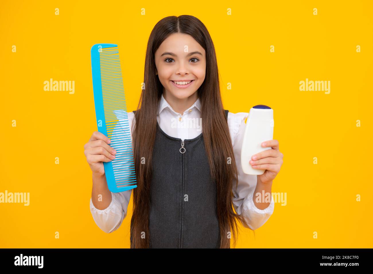 Child teen girl with shampoos conditioners and shower gel. Long hair ...