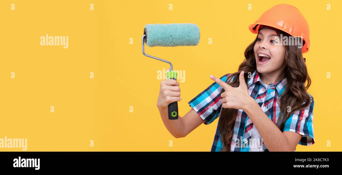 Builder teenager girl in helmet. happy teen girl with curly hair in ...