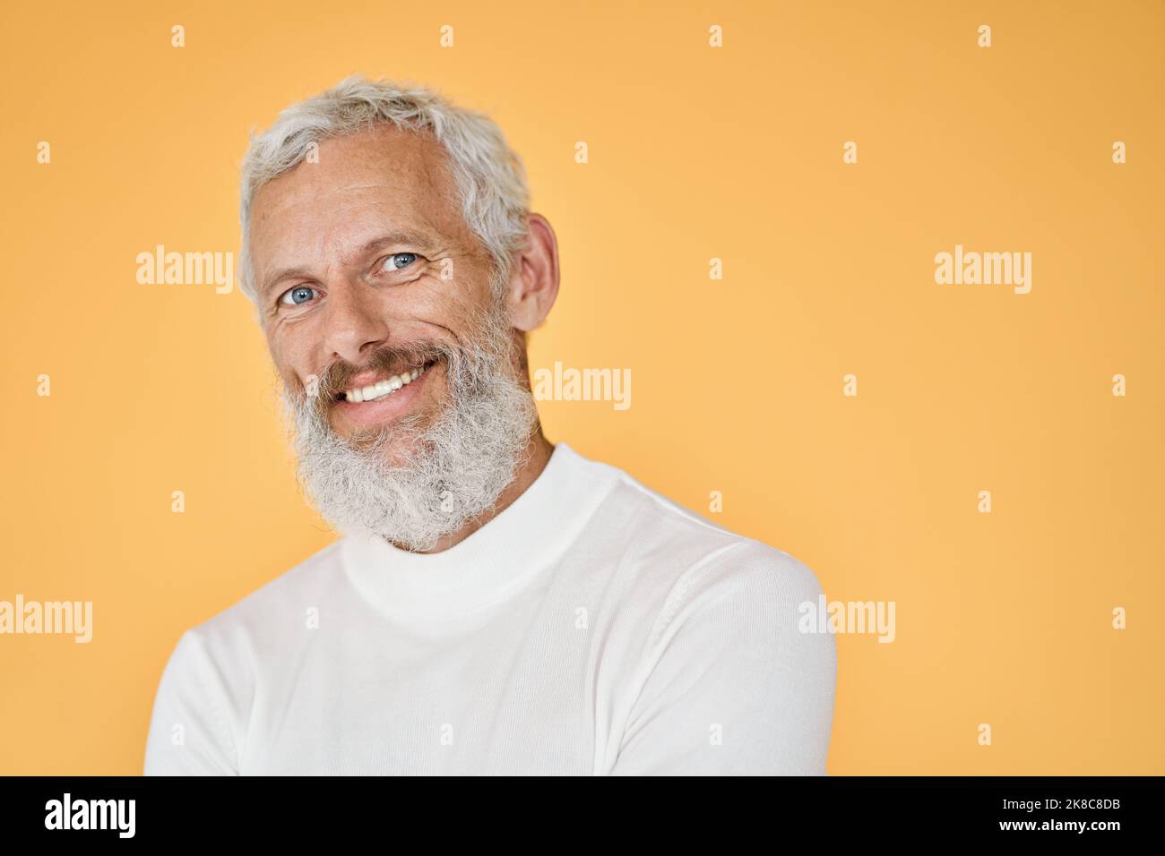 Happy old senior man isolated on yellow background, headshot portrait ...