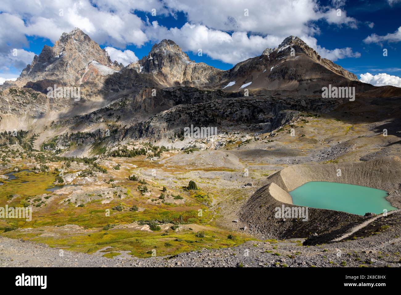 Schoolroom Glacier Lake resting below the Grand, Middle, and South ...