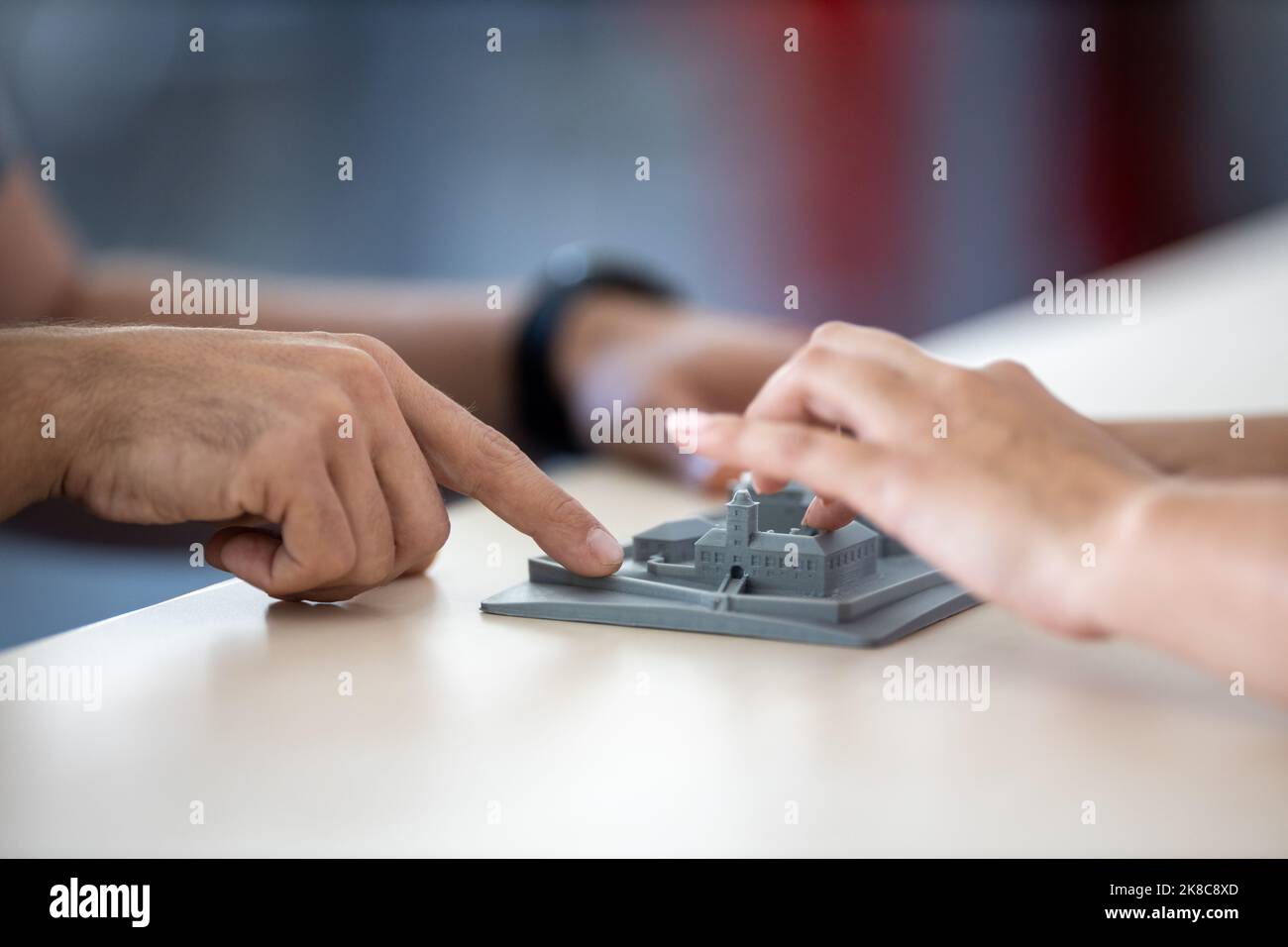 People with impaired vision using tactile maps, 3D models of town ...