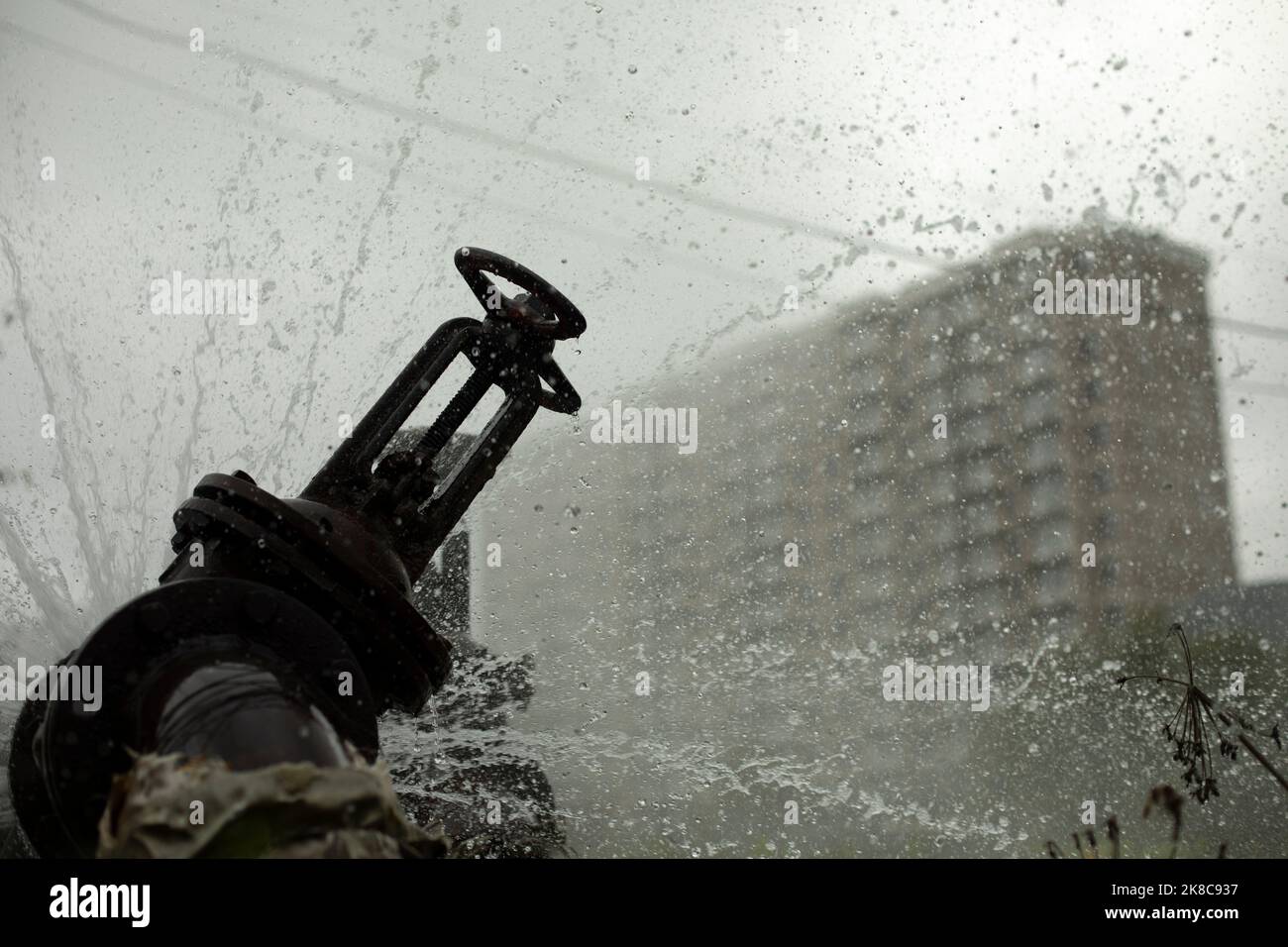 Valve on tube. Torn pipe valve. Boiling water pours from pipeline ...