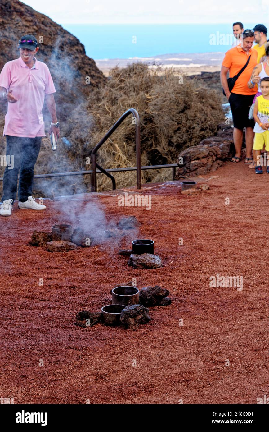 Steam vent or geyser on Montanas del Fuego. Demonstration of artificial ...