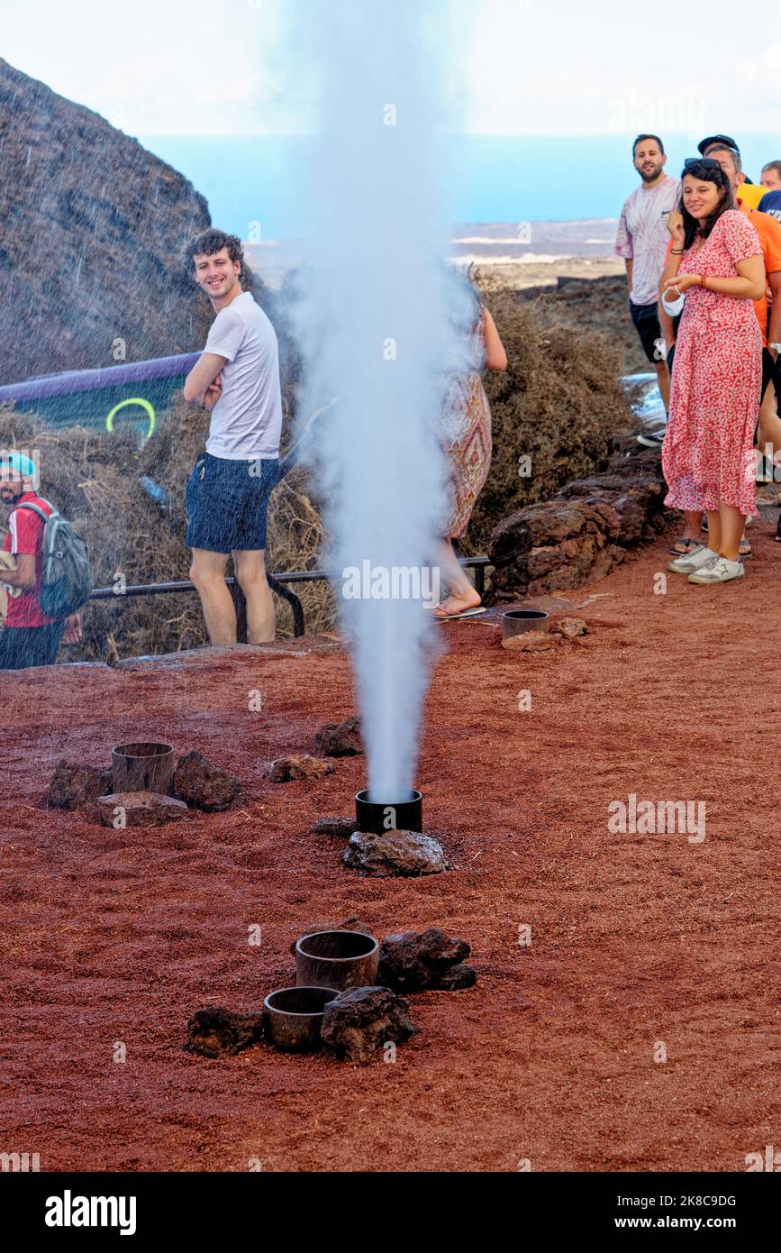 Steam vent or geyser on Montanas del Fuego. Demonstration of artificial ...